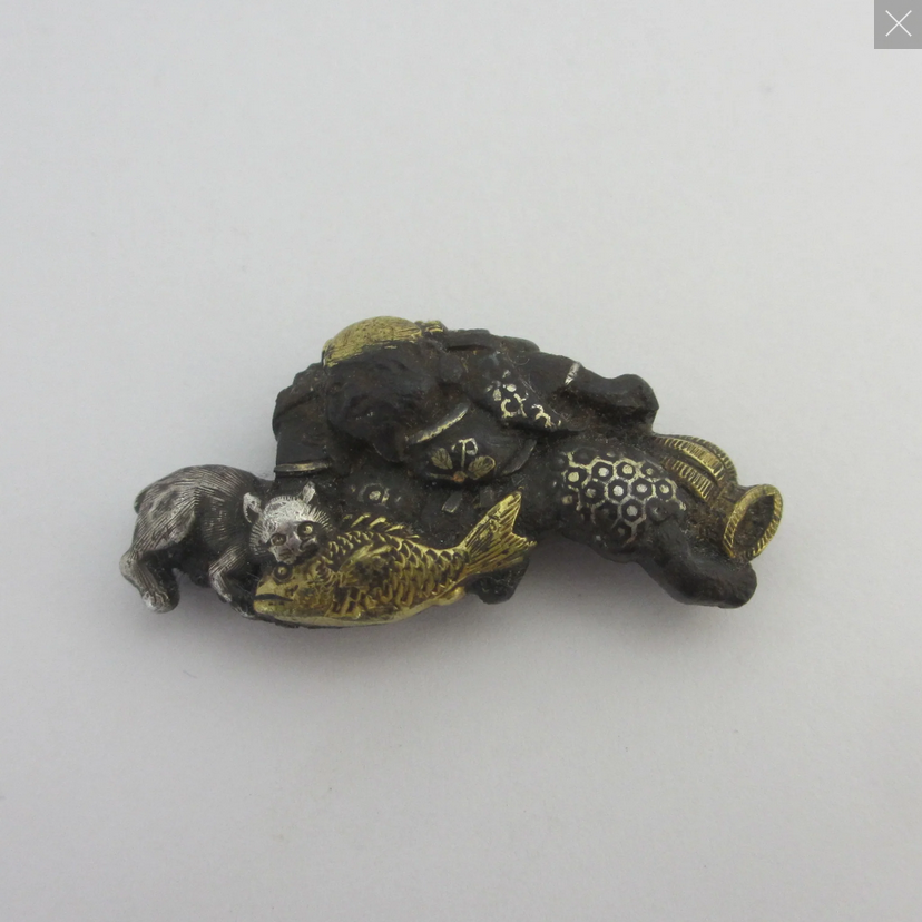 What is a Menuki - Top Banana Antiques